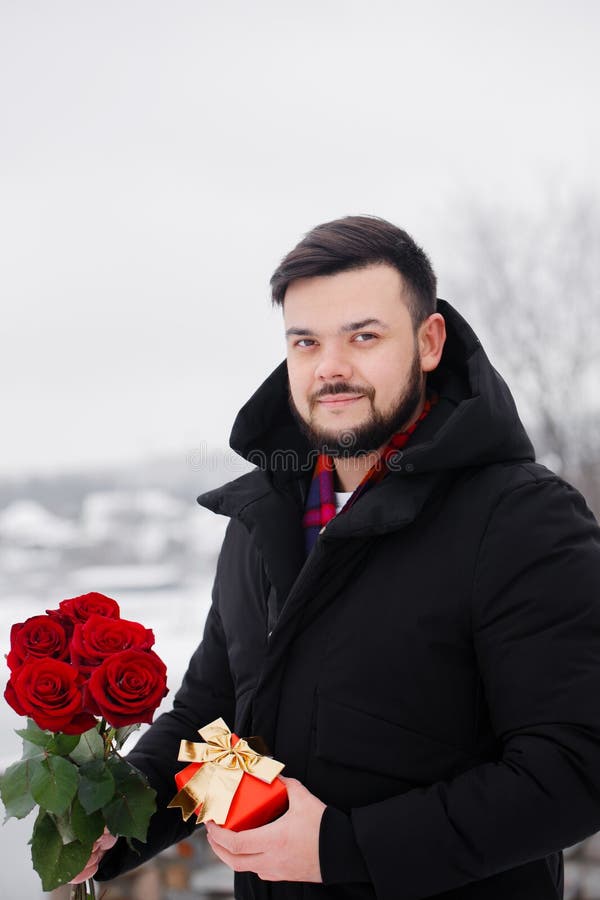 Guy with a Bouquet of Roses and a Red Box Stock Photo - Image of ...