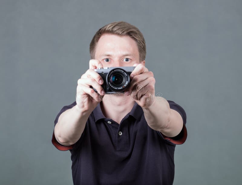 Guy with camera stock photo. Image of studio, people - 72238284