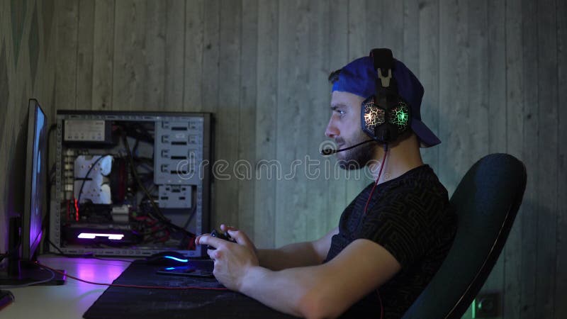 The Guy Carefully Plays Computer Games with a Joystick Stock Photo ...