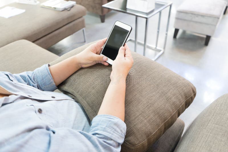 Two Friends Checking Smart Phone Online Content in a Park Stock Photo ...