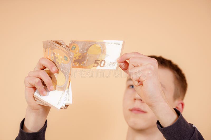 The Guy Checks the Authenticity of 50 Euro Banknotes Stock Photo ...