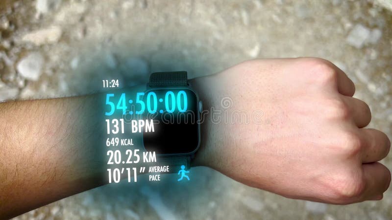 A Guy Checks the Status of His Running Training on His Smartwatch Using ...