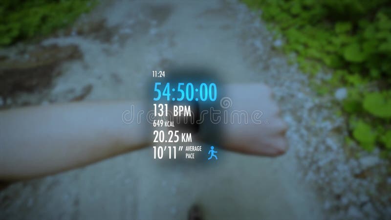A Guy Checks the Status of His Running Training on His Smartwatch Using ...