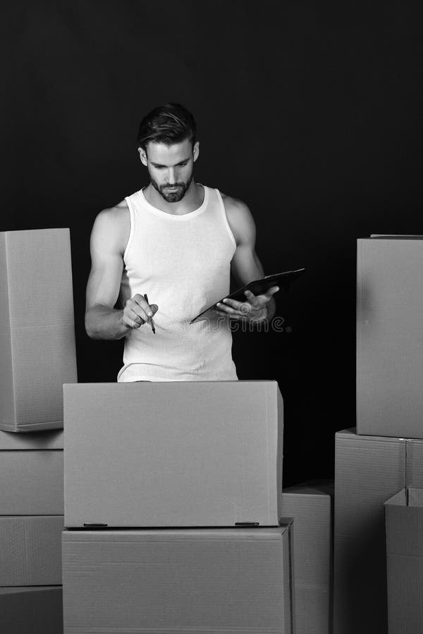 Guy with Clip Board Checking on Amount of Boxes Stock Image - Image of ...