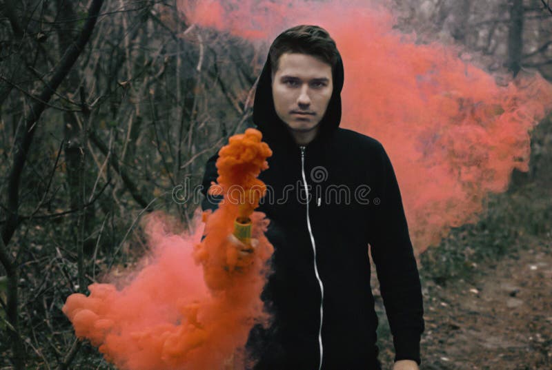 Guy with Colorful Smoke in Forest at Morning Stock Image - Image of ...