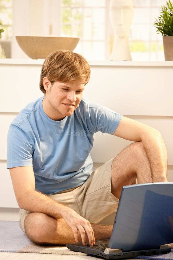 Guy with computer stock image. Image of indoor, male - 16418755