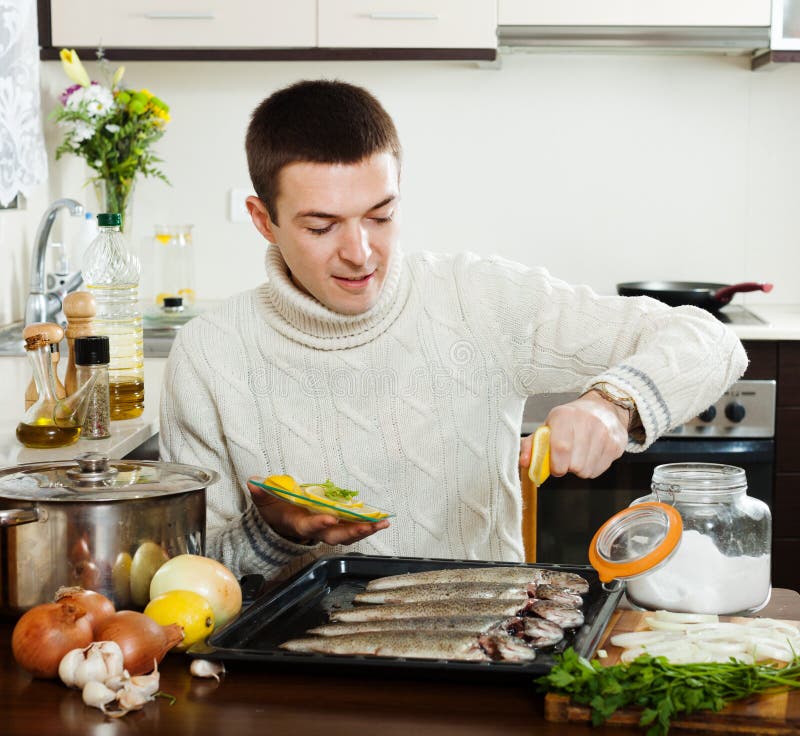 Guy Cooking Fish with Lemon in Baking Sheet Stock Photo - Image of home ...
