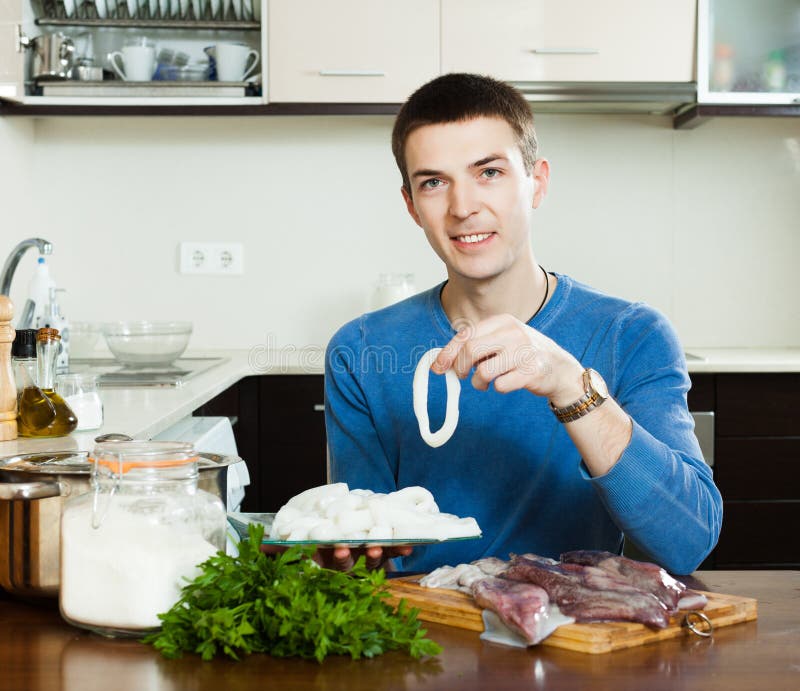 Guy Cooking in Home Kitchen Stock Photo - Image of calamaries, people ...
