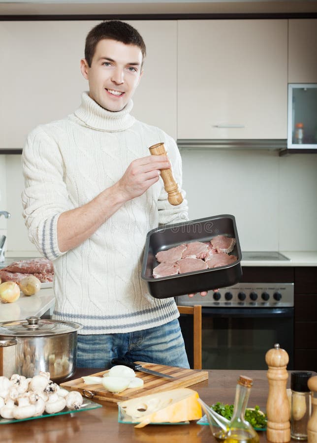 Guy cooking meat stock image. Image of roasting, orloff - 38216327