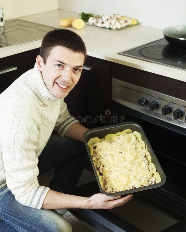 Guy Cooking Something at Kitchen Stock Photo - Image of meat, kitchen ...