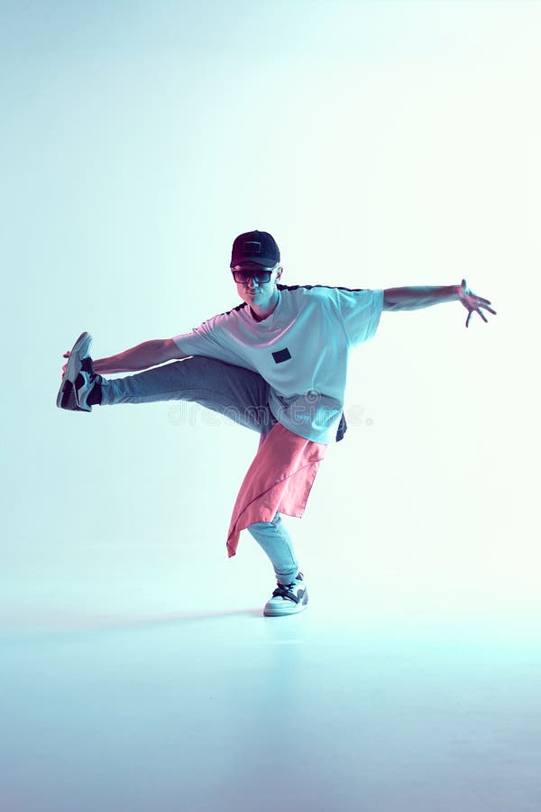 Guy Dancing Contemporary Dance in Studio. Neon Light Blue Background ...