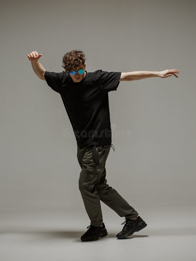 Guy Dancing Contemporary Dance in Studio. Neutral Grey Background ...