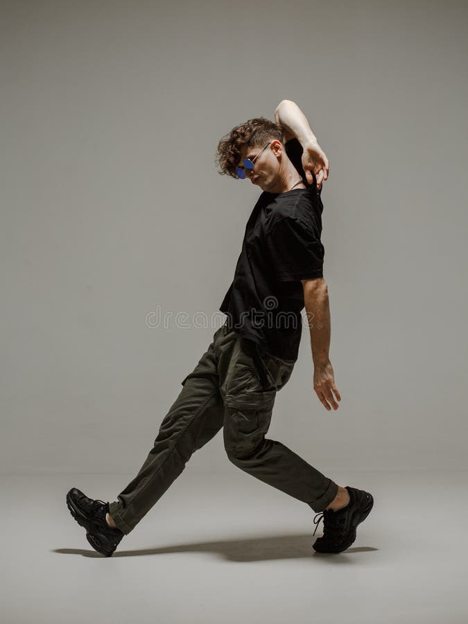 Guy Dancing Contemporary Dance in Studio. Neutral Grey Background ...
