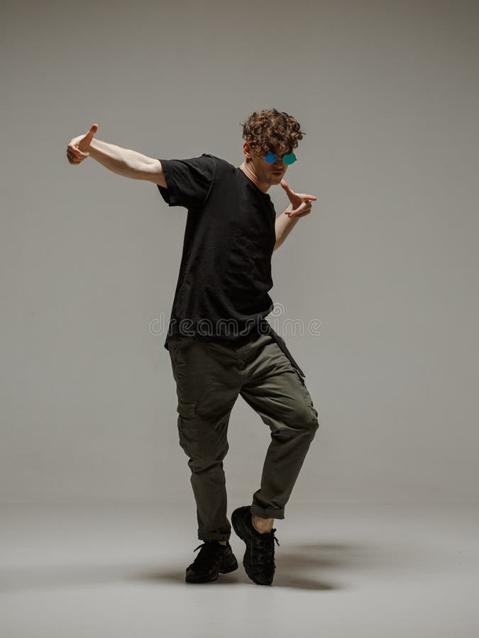Guy Dancing Contemporary Dance in Studio. Neutral Grey Background ...