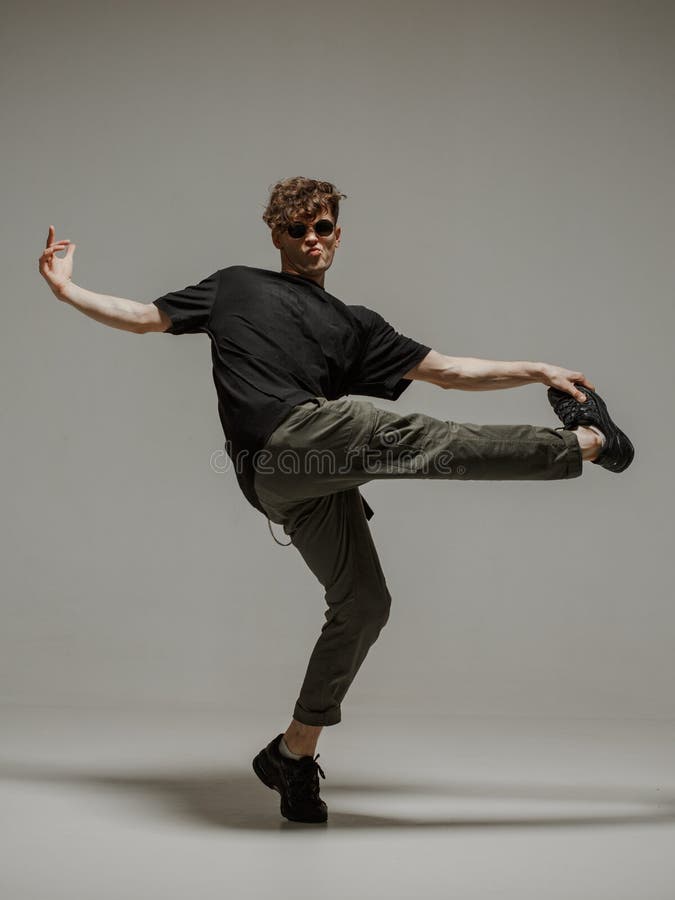 Guy Dancing Contemporary Dance in Studio. Neutral Grey Background ...