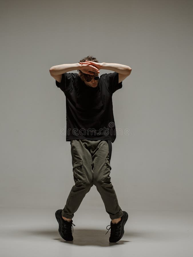 Guy Dancing Contemporary Dance in Studio. Neutral Grey Background ...
