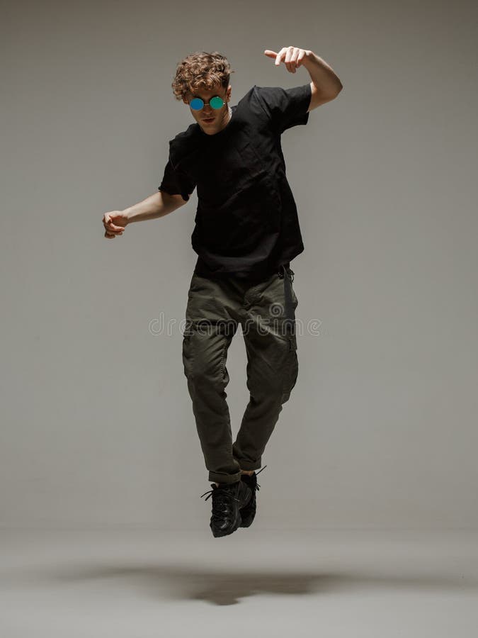 Guy Dancing Contemporary Dance In Studio. Neutral Grey Background ...