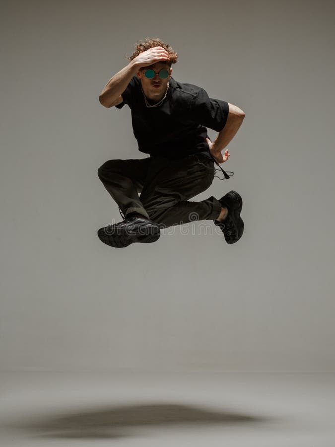 Guy Dancing Contemporary Dance in Studio. Neutral Grey Background ...