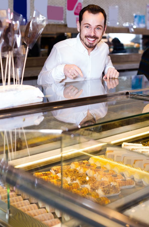 Guy Deciding on Best Dessert in Bakery Stock Image - Image of food ...