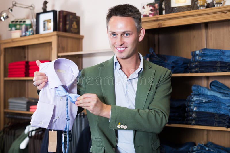 Guy deciding on new shirt stock image. Image of silk - 91671939