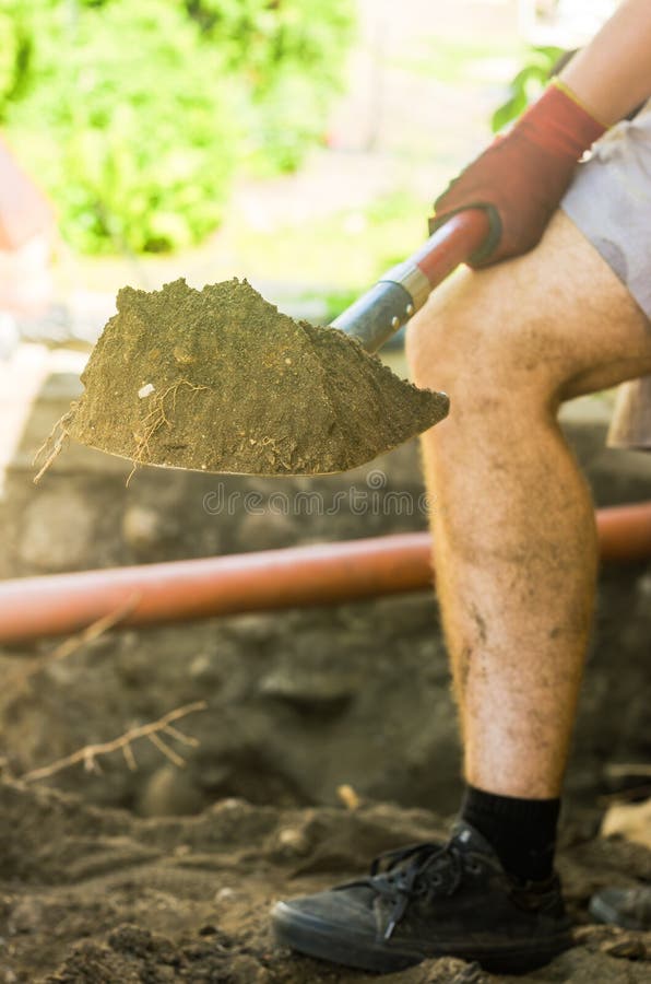 Guy is Digging Ground. Man with Shovel. Digging Up Soil. Work on Land ...
