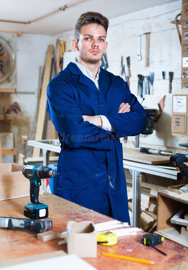 Guy Displaying His Workplace and Tools at Workshop Stock Image - Image ...