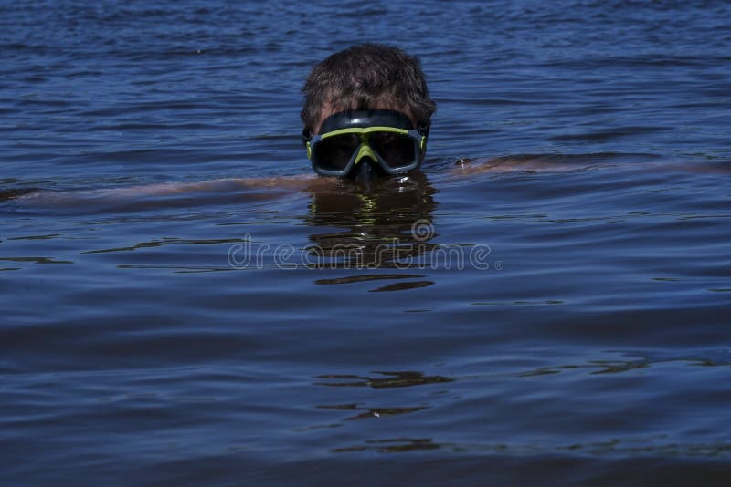 A Guy in a Diving Mask Dives Out of the Water Stock Image - Image of ...