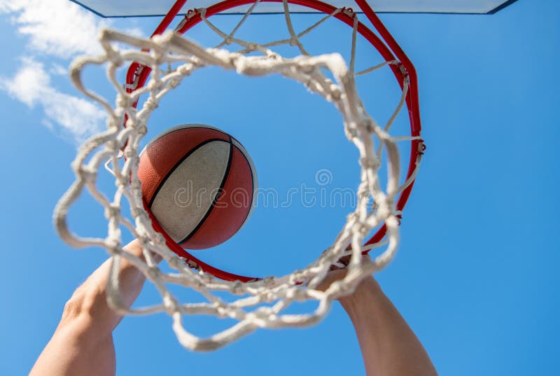 Guy Dunking Basketball Ball through Net Ring with Hands, Targeting ...