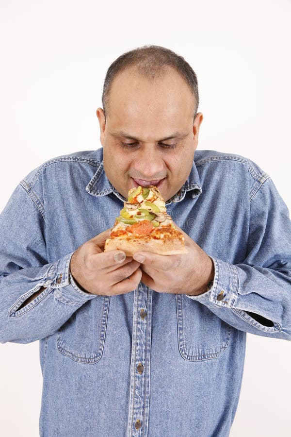 Guy eating pizza slice stock image. Image of baked, sauce - 12749159