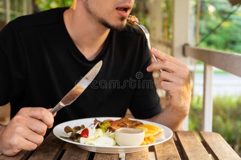 Guy Eating Steak at a Table in a Summer Cafe Stock Photo - Image of ...