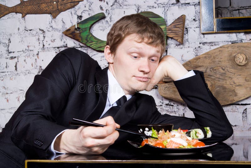 Guy Eats Sushi in a Restaurant Stock Image - Image of china, life: 24538361