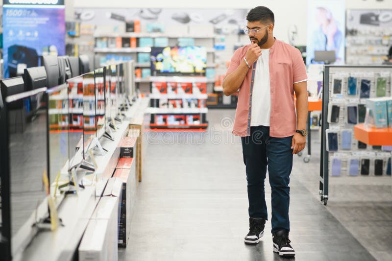Indian Man in an Electronics Store Stock Image - Image of retail ...