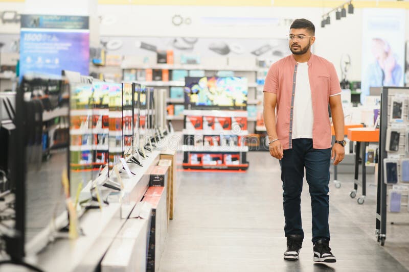 Indian Man in an Electronics Store Stock Image - Image of design ...