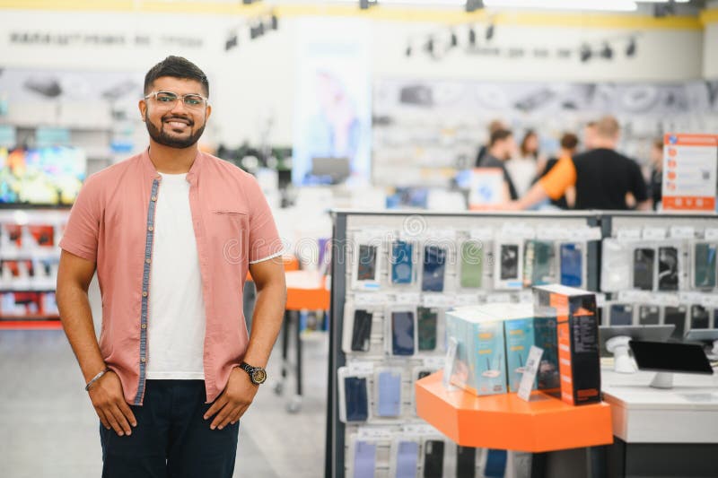 Indian Man in an Electronics Store Stock Image - Image of male, product ...