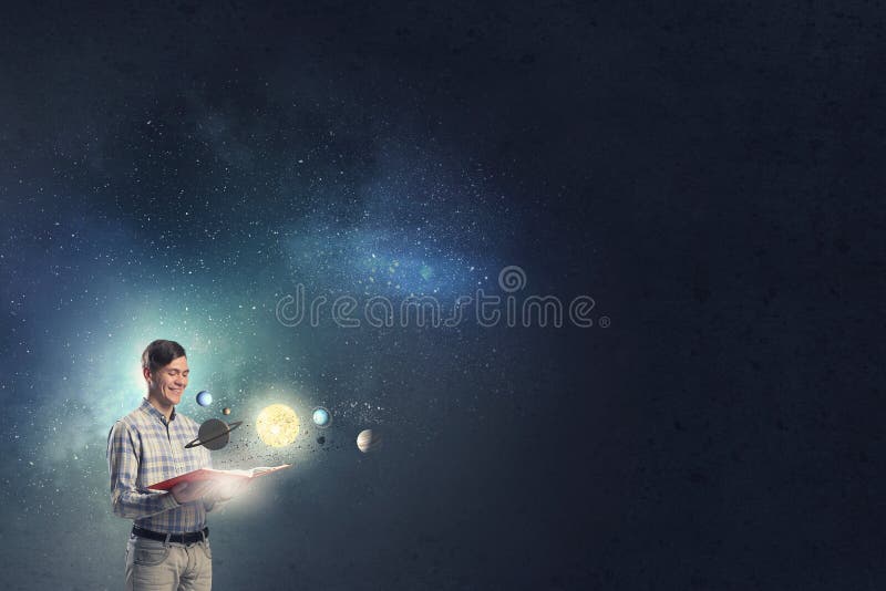 Guy exploring space stock photo. Image of book, male - 62890194