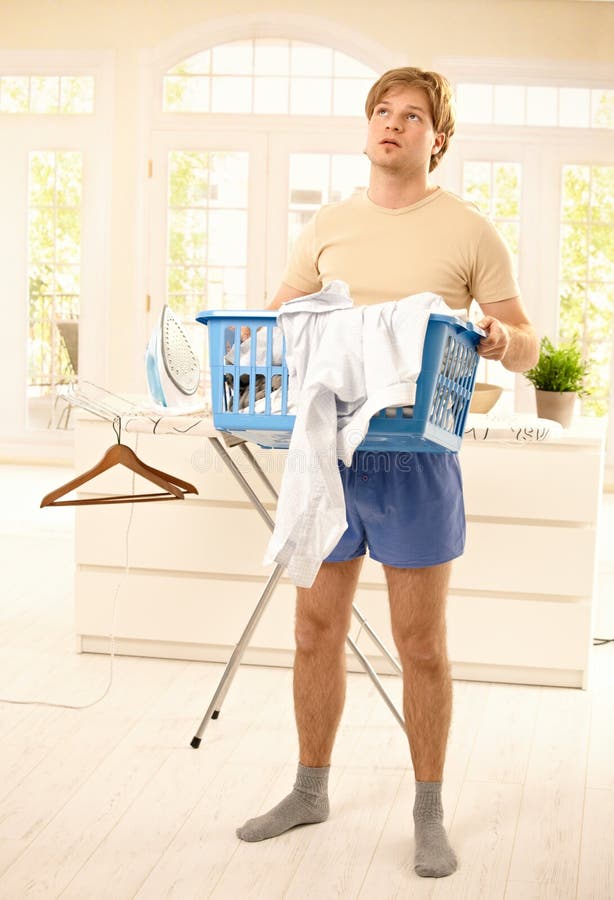 Guy fed up with housework stock photo. Image of american - 19674246