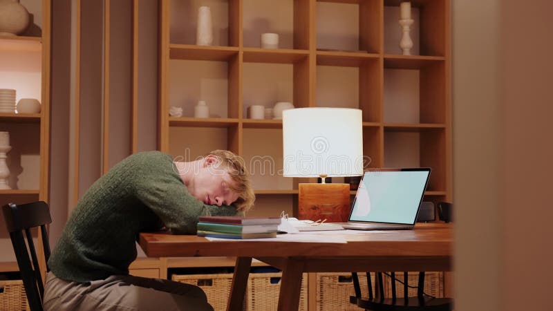 Guy Fell Asleep while Doing Homework at the Table, Lying on Books, Side ...