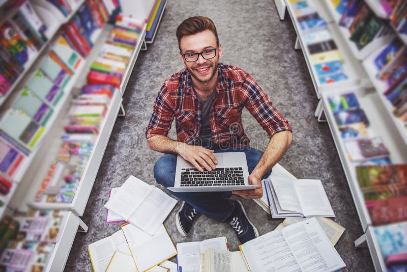 Guy with Gadget at the Bookshop Stock Image - Image of lifestyle, adult ...