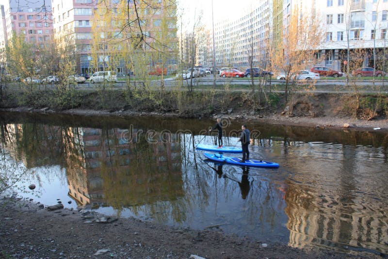 A Guy and a Girl on a Board Traveling on the River Stock Photo - Image ...
