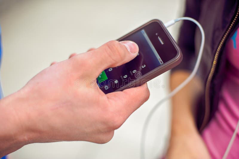 Guy and Girl Exchanging Telephone Numbers Stock Photo - Image of phone ...