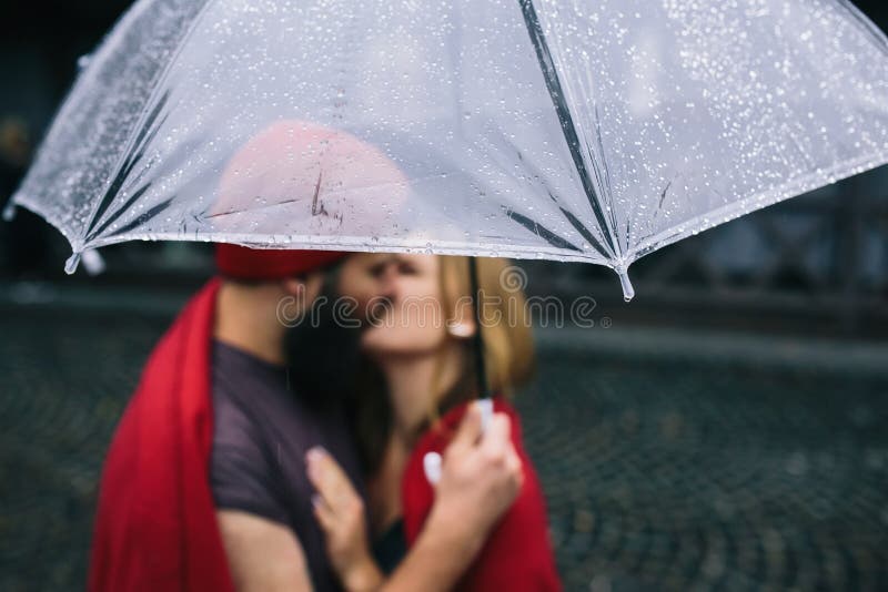 Guy And The Girl Kissing Under An Umbrella Stock Image Image Of