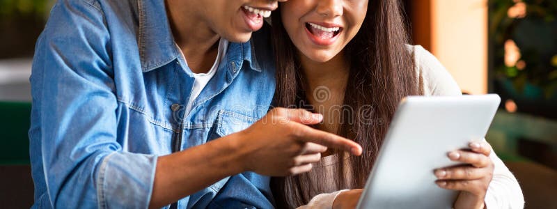 Guy and Girl Looking at Tablet Computer, Cropped Stock Image - Image of ...