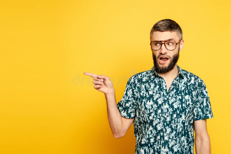 Guy in Glasses Pointing with Finger Aside on Yellow Stock Photo - Image ... Guy in Glasses Pointing with Finger Aside on Yellow Stock Photo - Image ...