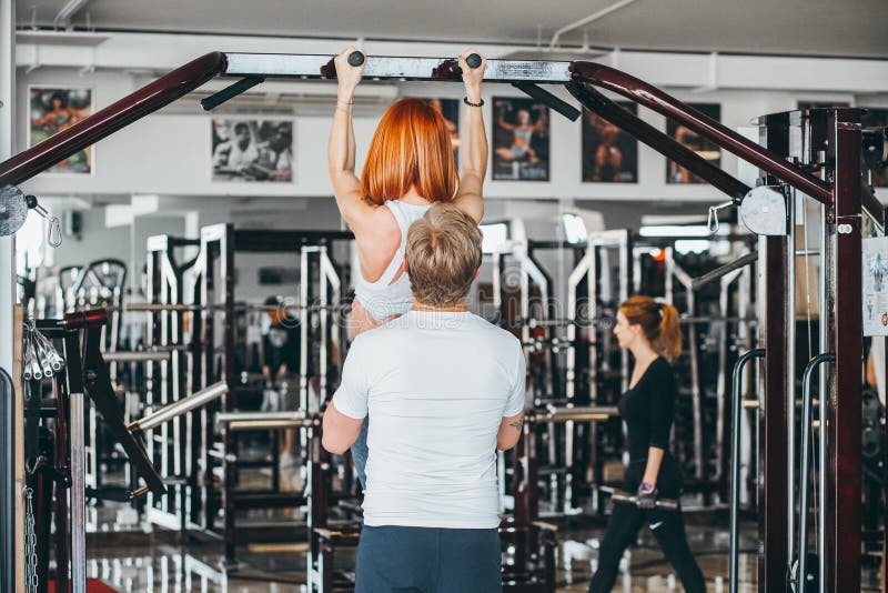 Guy Hepl Girlfriend on Training in Gym Stock Image - Image of female ...