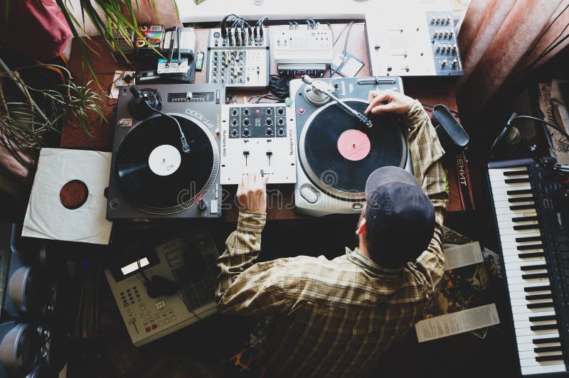 The Guy is a Hip-hop DJ in a Home Studio Playing Records .Hip-hop ...
