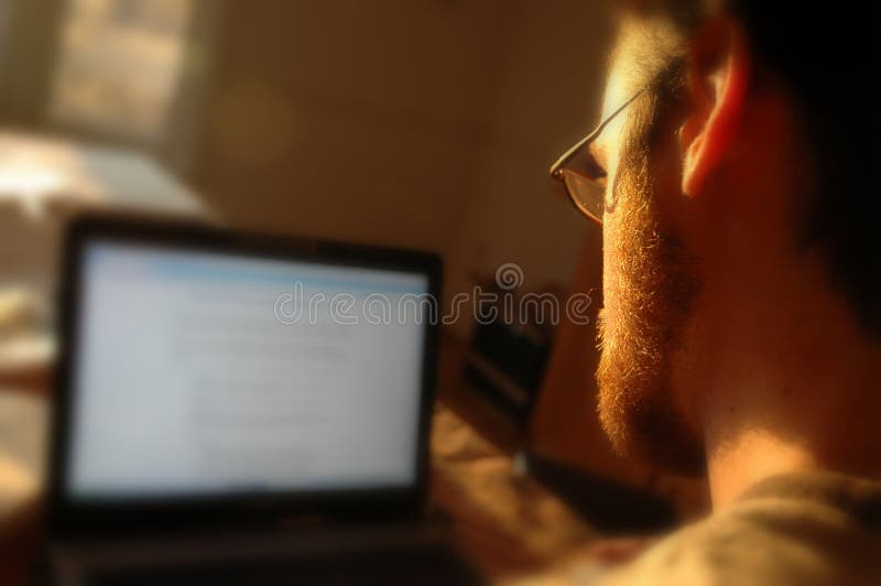 Guy at his laptop computer stock image. Image of modem - 737233