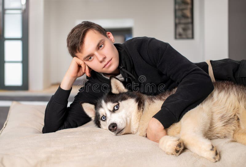 Guy with His Siberian Husky at Home. Love Animals Stock Image - Image ...