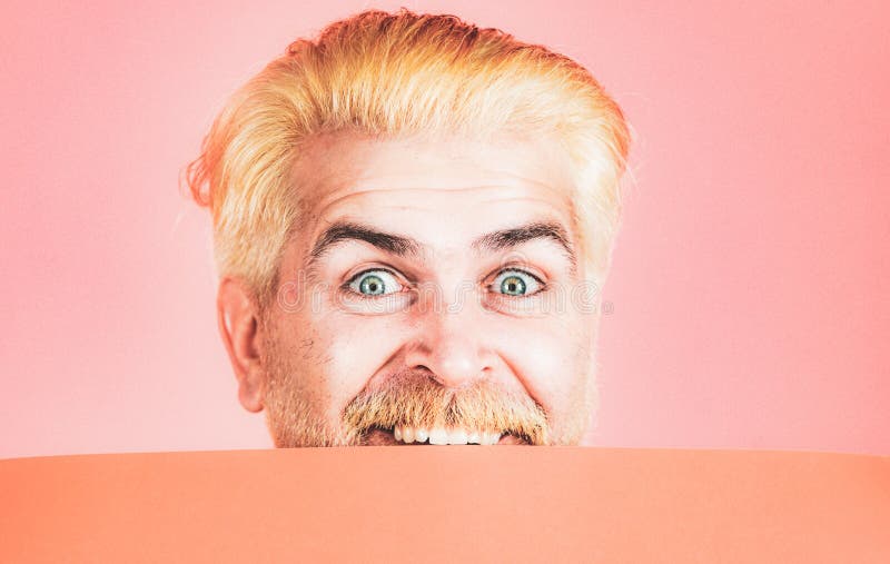 Guy Holding Advertising Board, Red Studio Background. Stock Image ...