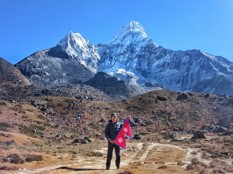 Guy Holding National Flag of Nepal Against Himalaya Mountain Peak ... Guy Holding National Flag of Nepal Against Himalaya Mountain Peak ...