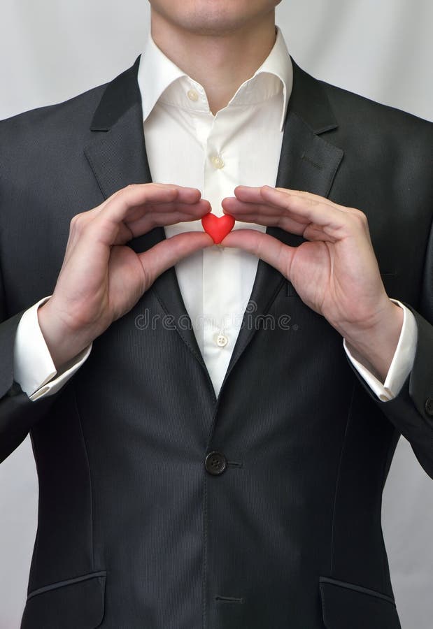 Guy holding a red heart stock image. Image of hands, card - 28554543